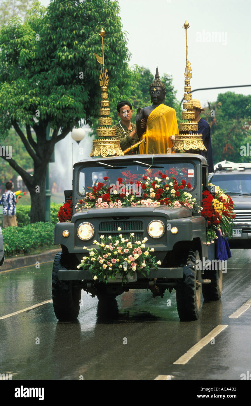 Moving a Buddha statue in preparation for a procession at Songkran the ...