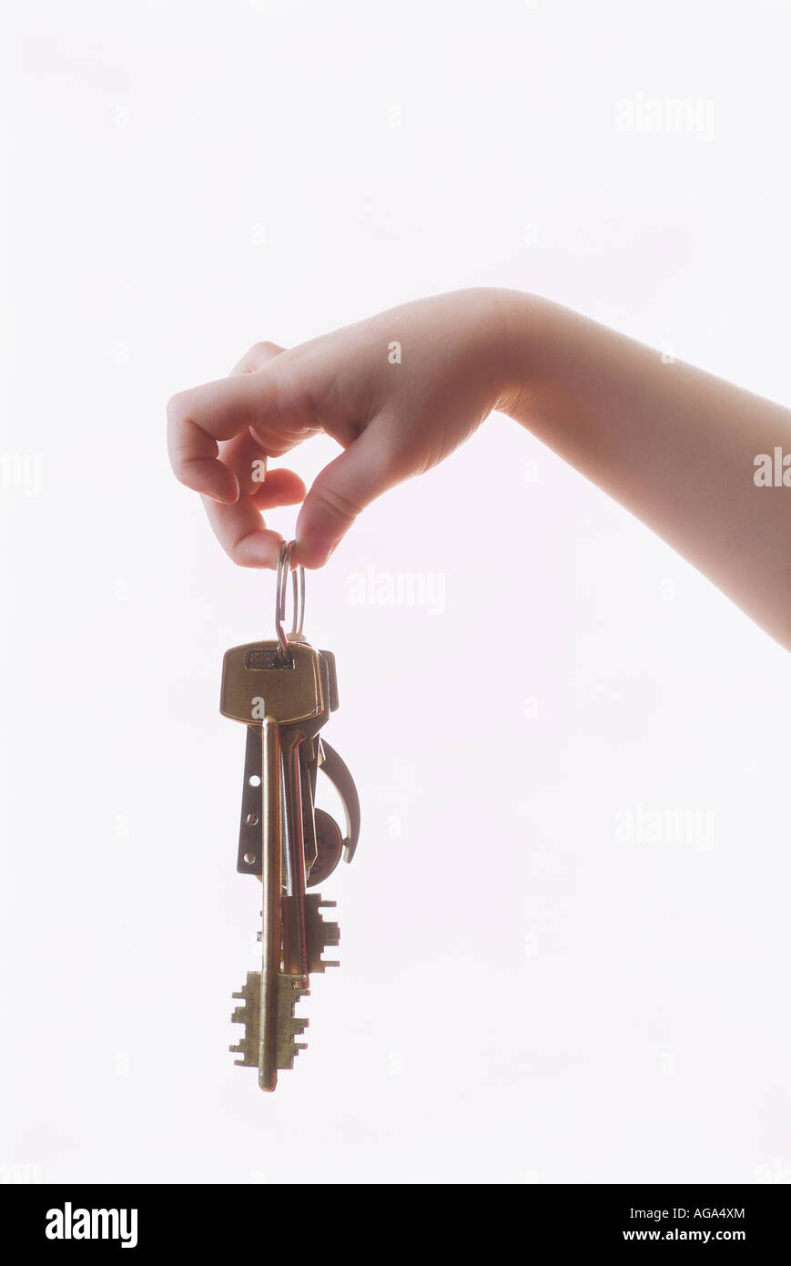 Person holding keys Stock Photo - Alamy