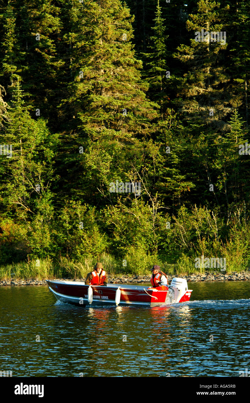 Michigan couple fishing shirts in boat on Lake Superior red Stock Photo ...