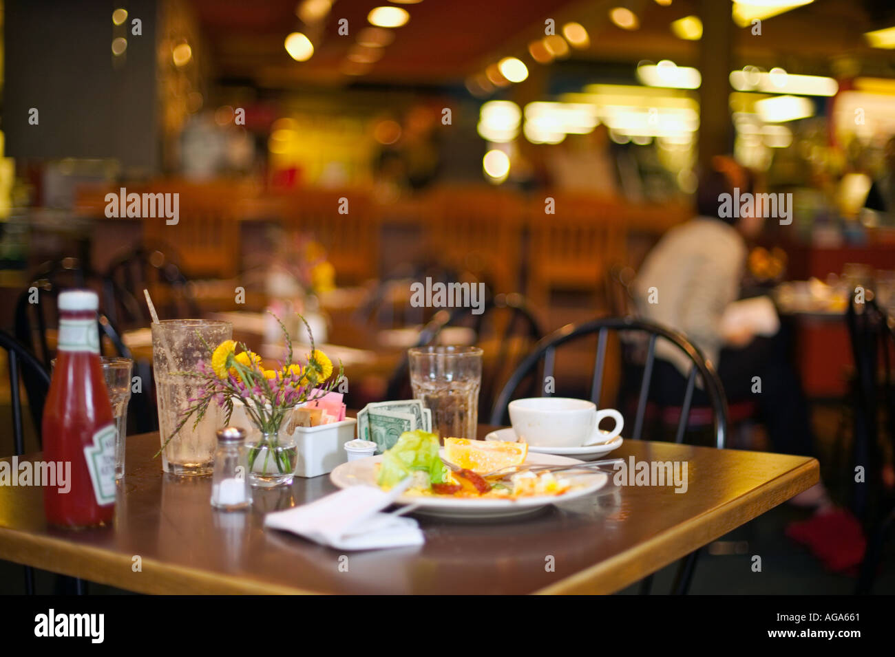 Tip and dirty dishes on restaurant table after finishing a meal Boston ...
