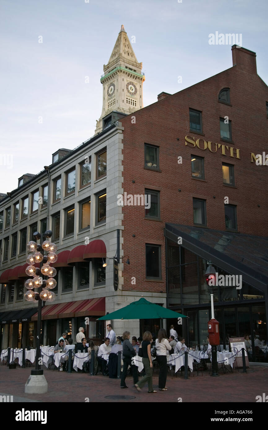 Outdoor dining at restaurant in Quincy Market with Customs House tower ...
