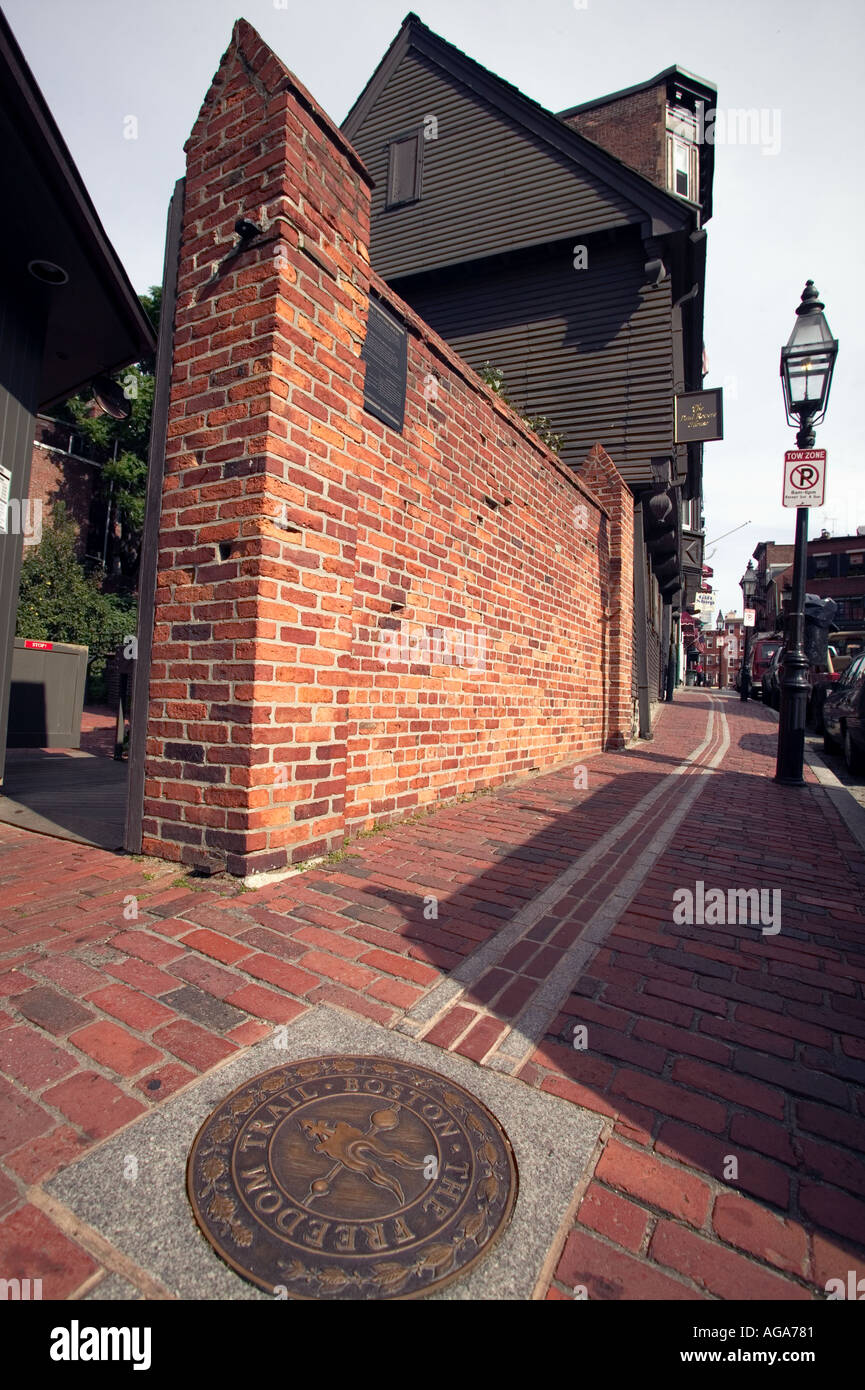 Round bronze marker emblem on the red brick Freedom Trail in North ...