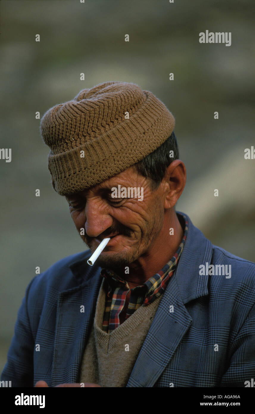 Berber mule keeper smoking a cigarette Imilchil Area the High Atlas ...