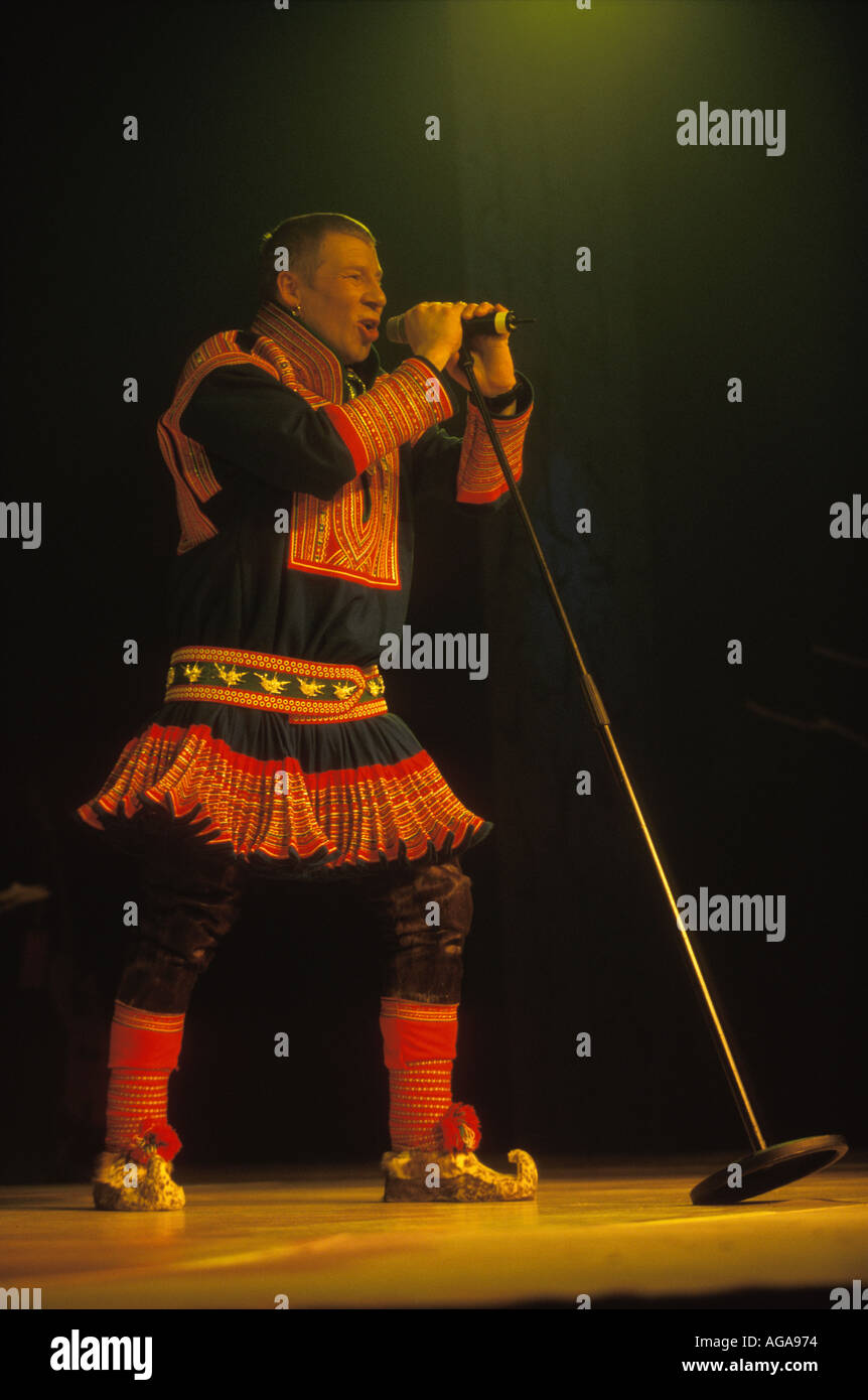 A Saami man dressed in traditional clothes participates in a song ...