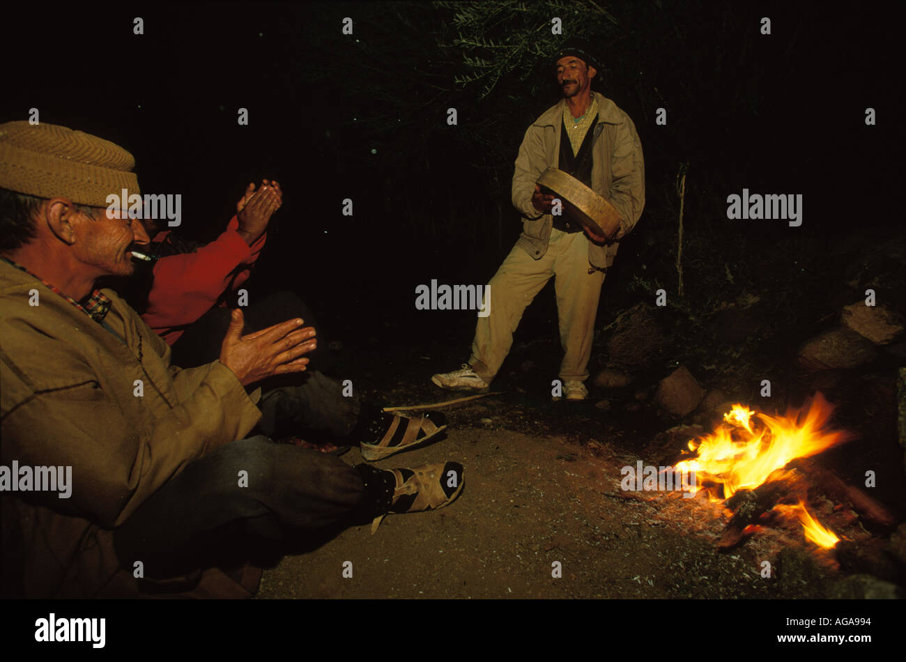 Mule keepers singing Berber songs by the campfire during a trek through ...