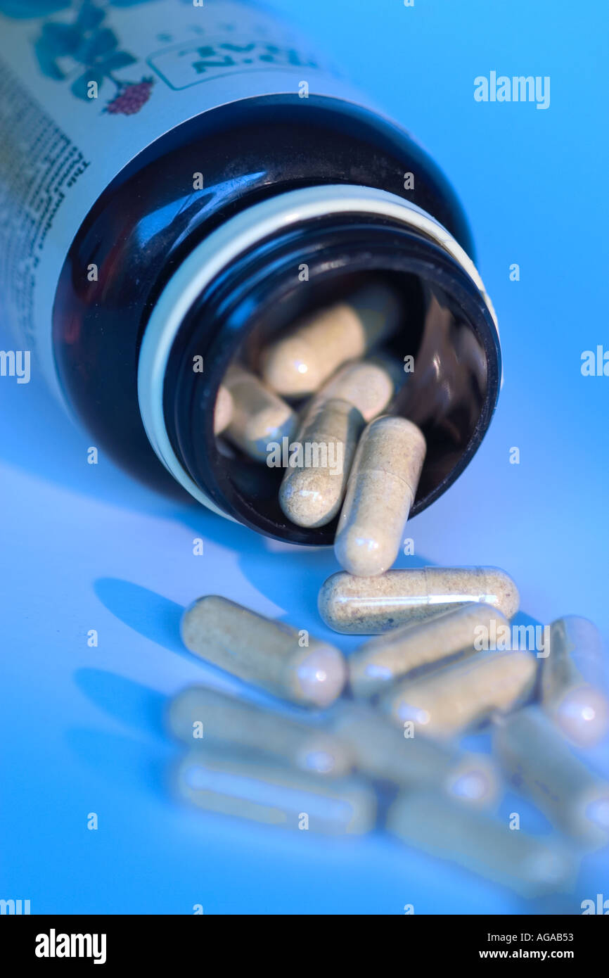 Vitamin Capsules Spilling from open Container Stock Photo - Alamy