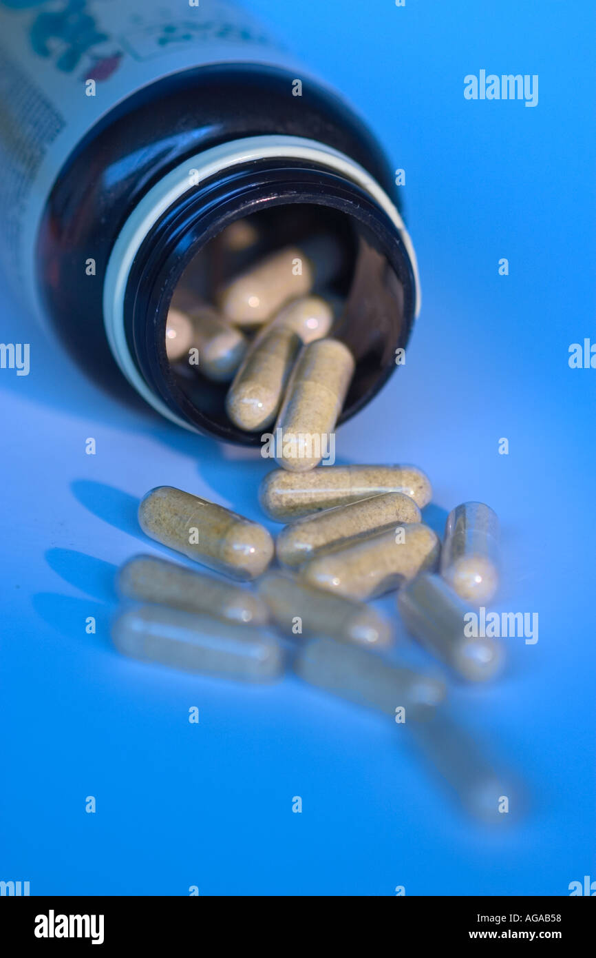 Vitamin Capsules Spilling from open Container Stock Photo - Alamy