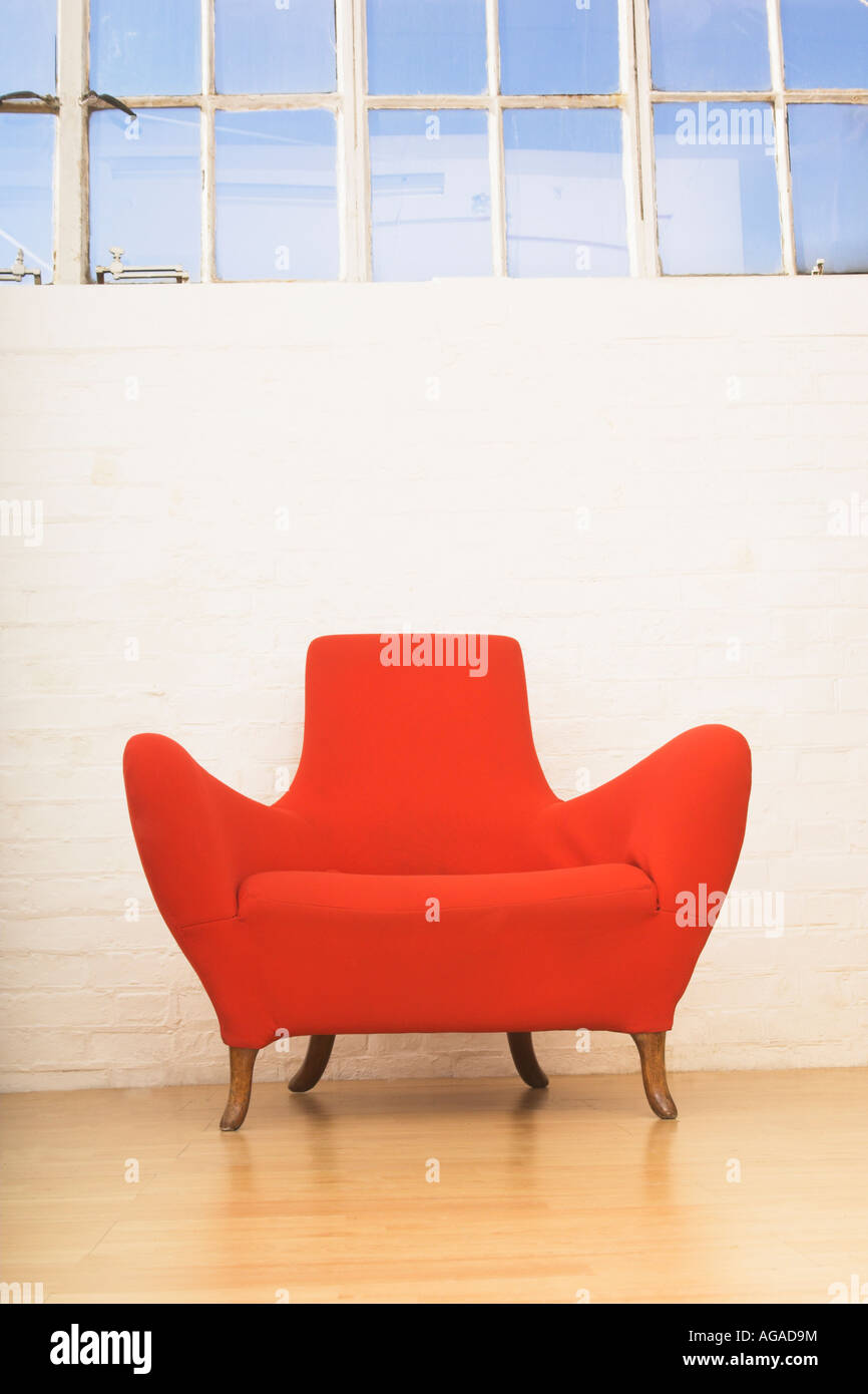 still life of single red arm chair Stock Photo - Alamy
