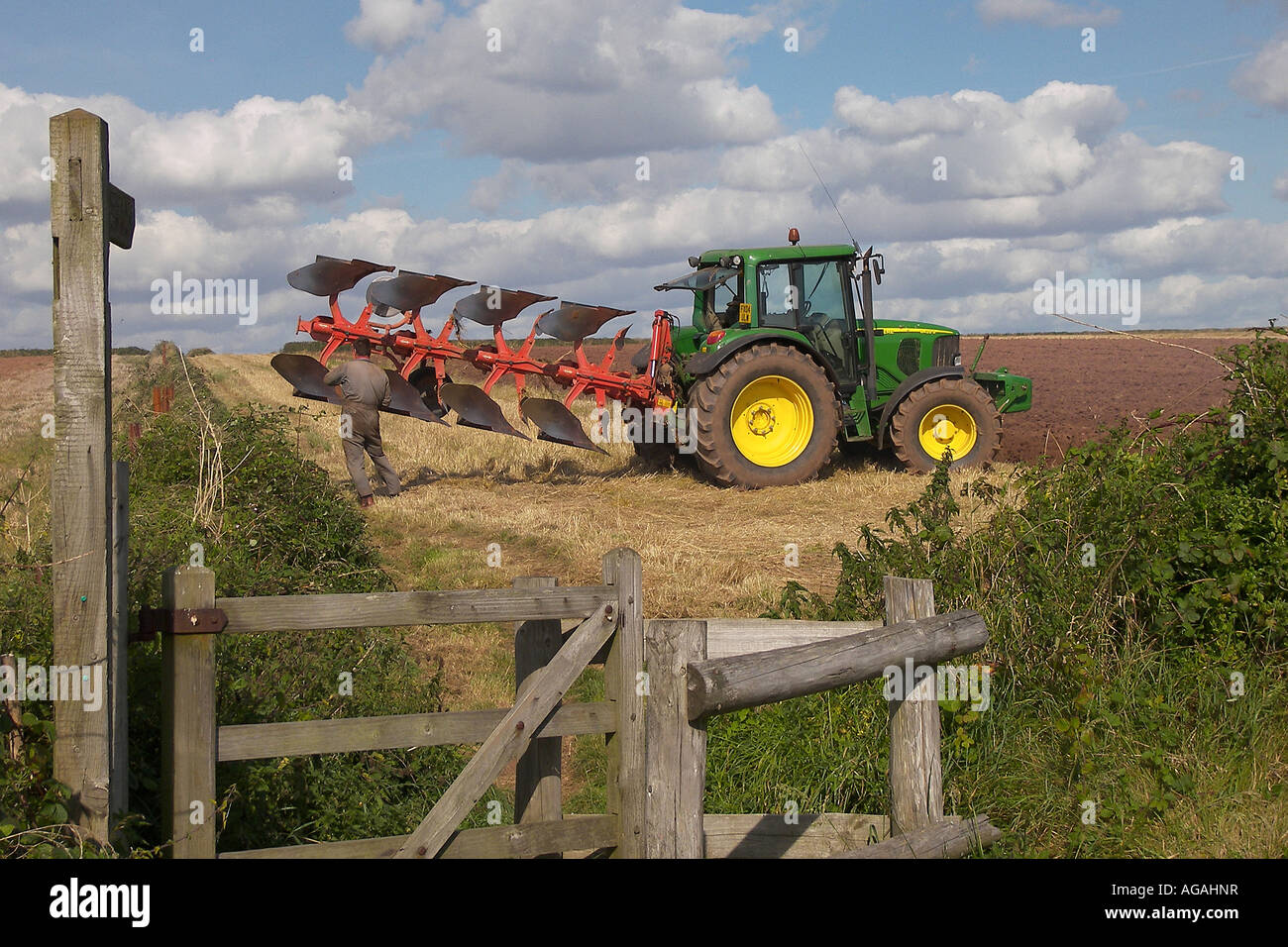Tractor and Plough Stock Photo - Alamy