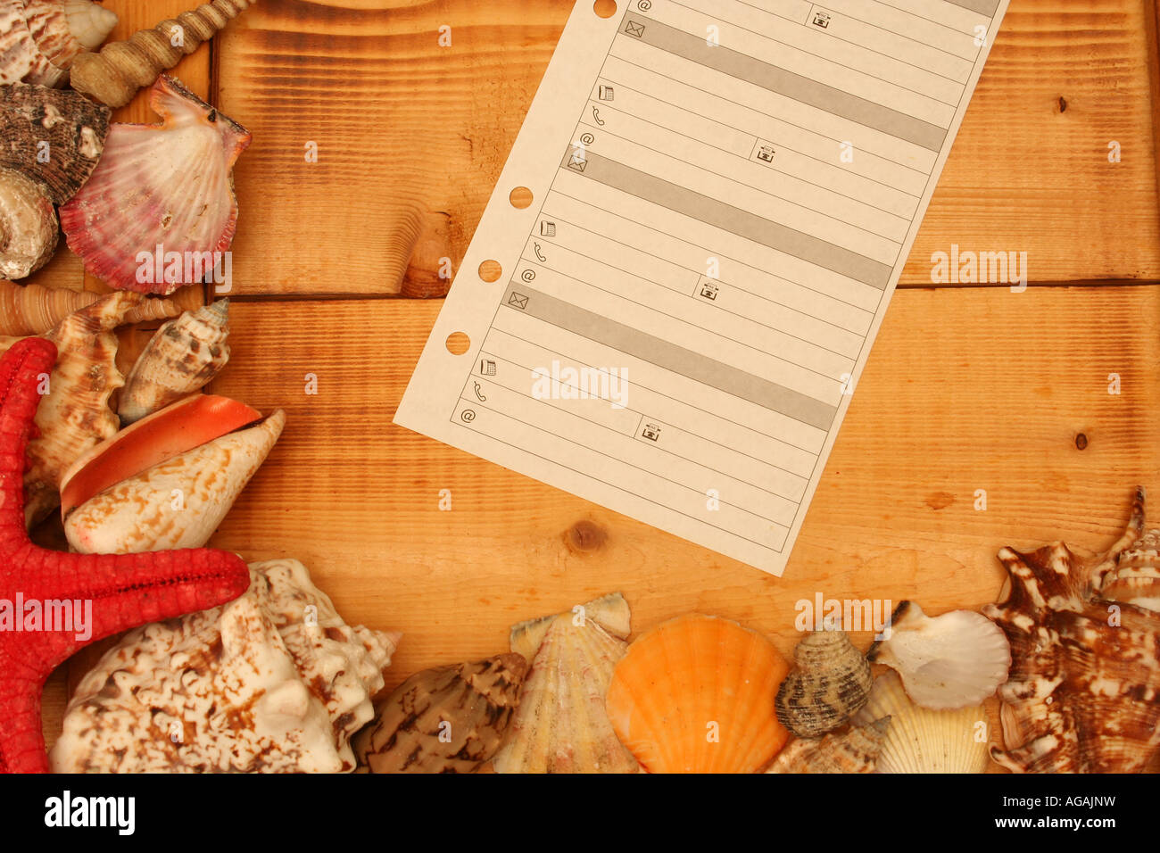A blank organizer page on wood with shells Stock Photo - Alamy