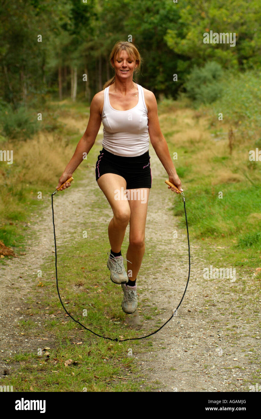 Woman Skipping and Running on a Keep Fit Exercise Stock Photo - Alamy