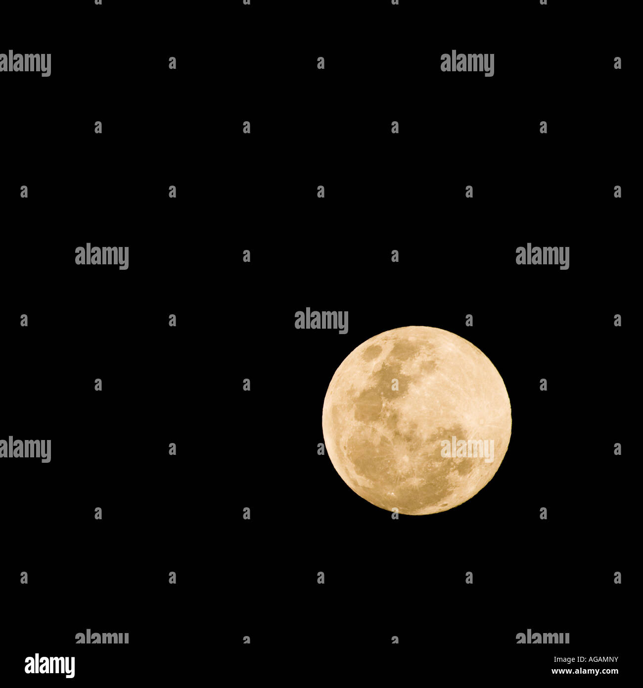 African full moon glowing orange in the night sky Stock Photo - Alamy