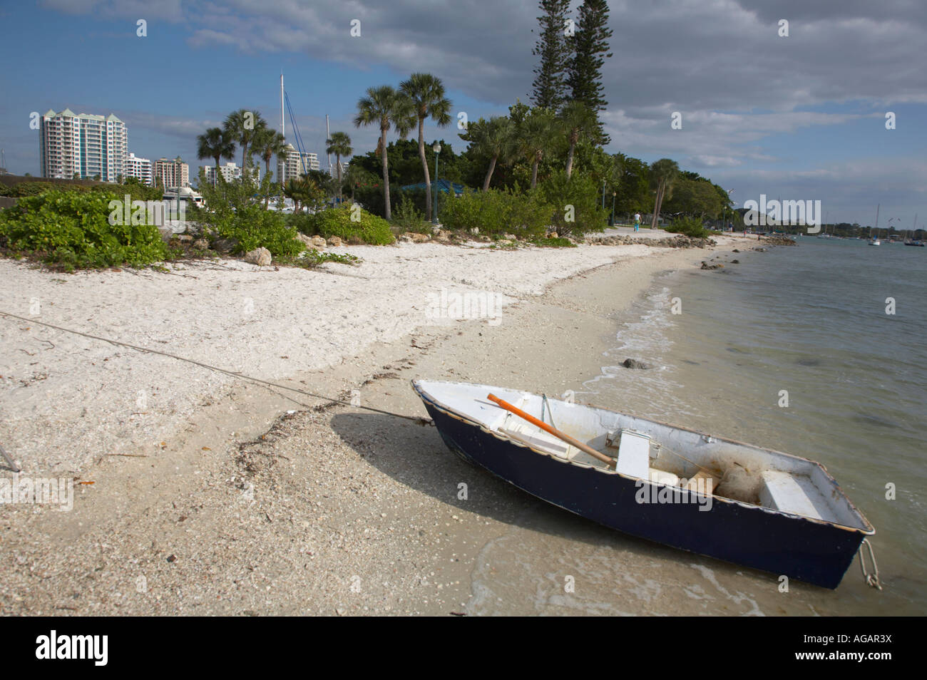 Small rowboat on beach at Sarasota Bayfront Park in Sarasota Bay on the ...