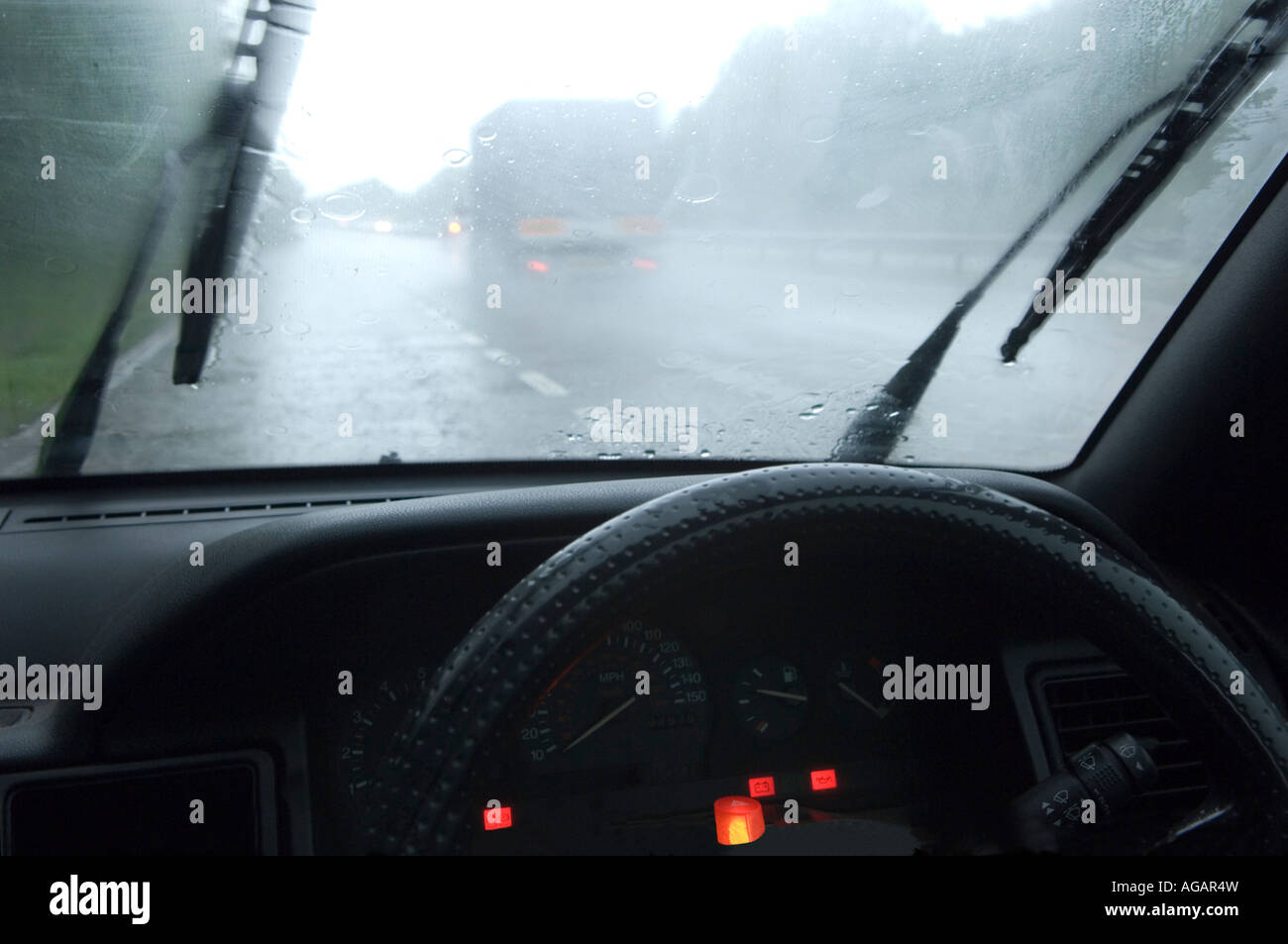 Car broken down on a dual carriageway in bad weather Stock Photo - Alamy