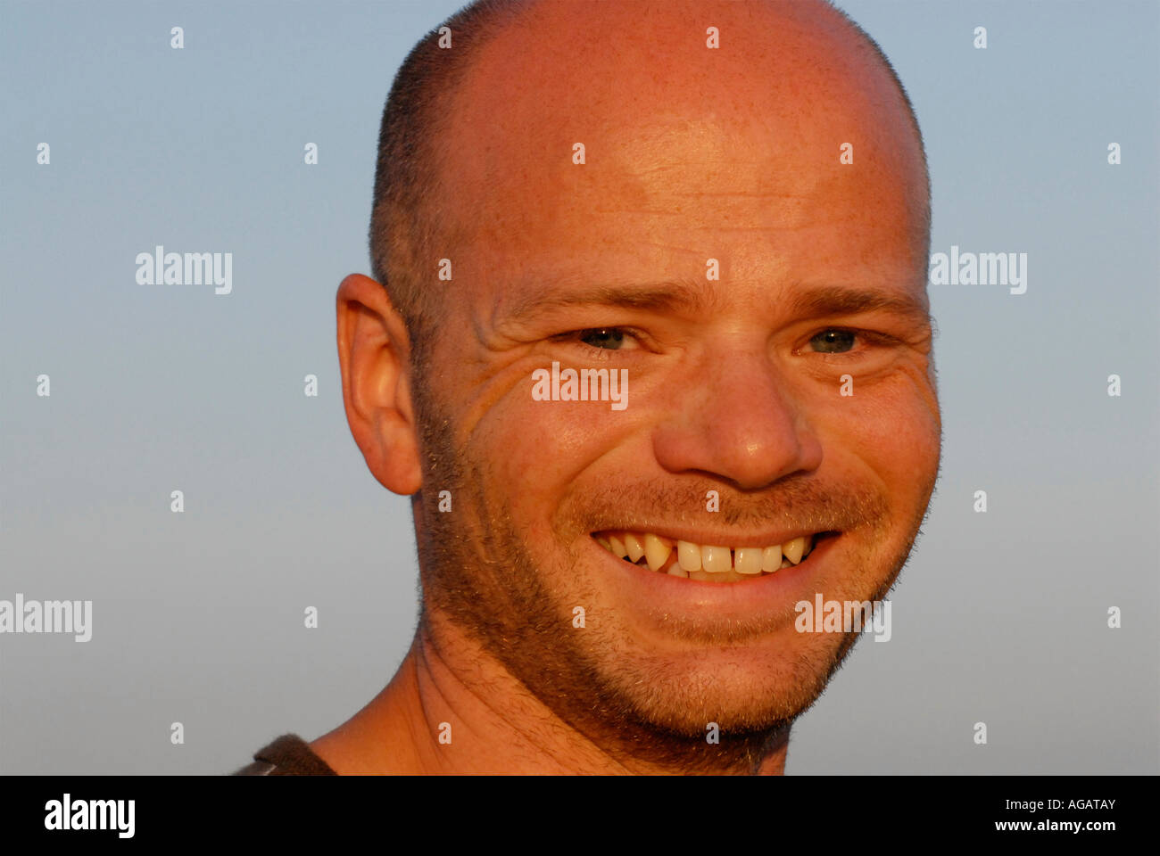 Portrait of a bald headed man smiling Stock Photo - Alamy