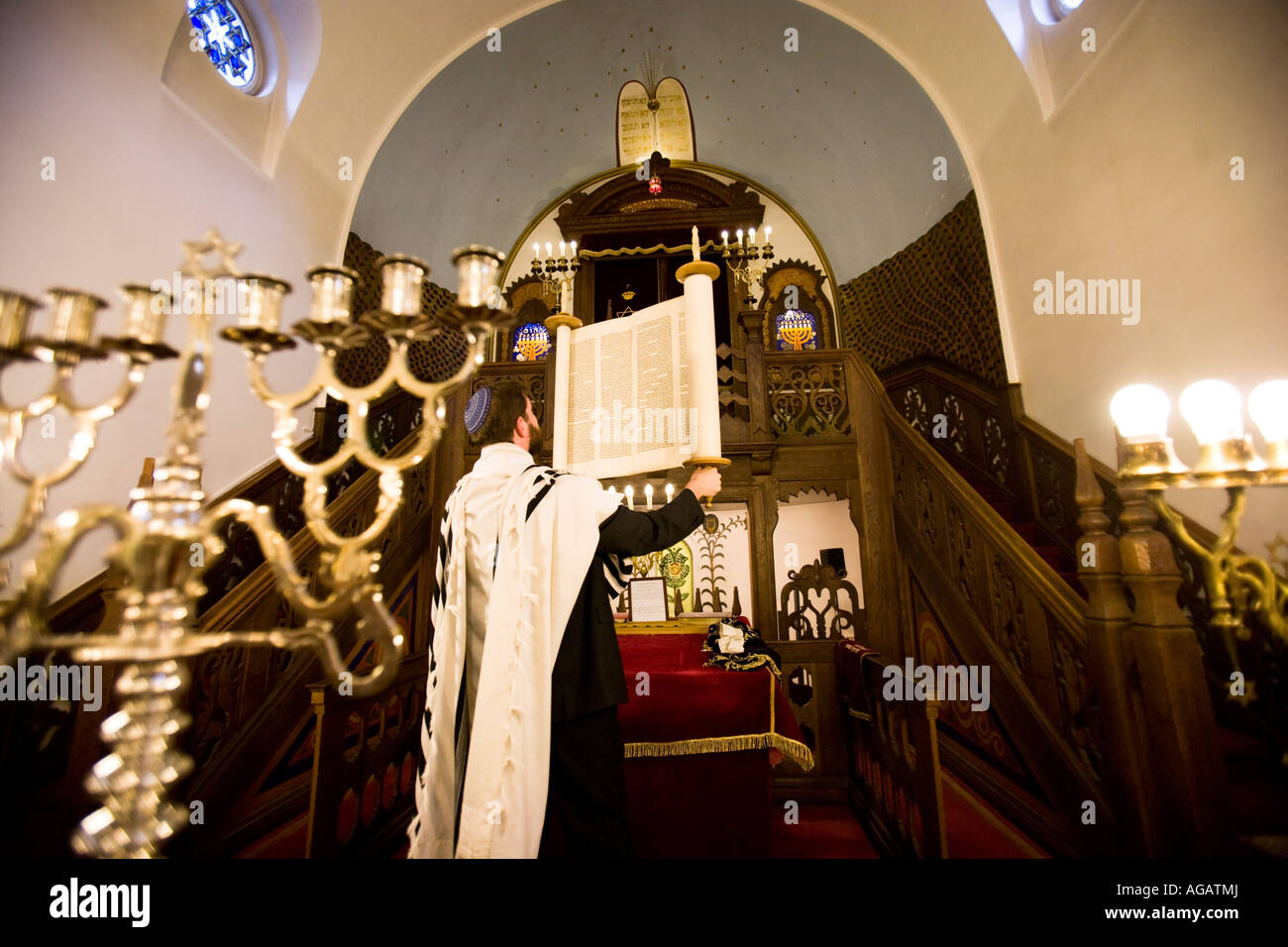 A jewish priest reading from the Tora inside a synagogue in Oslo ...