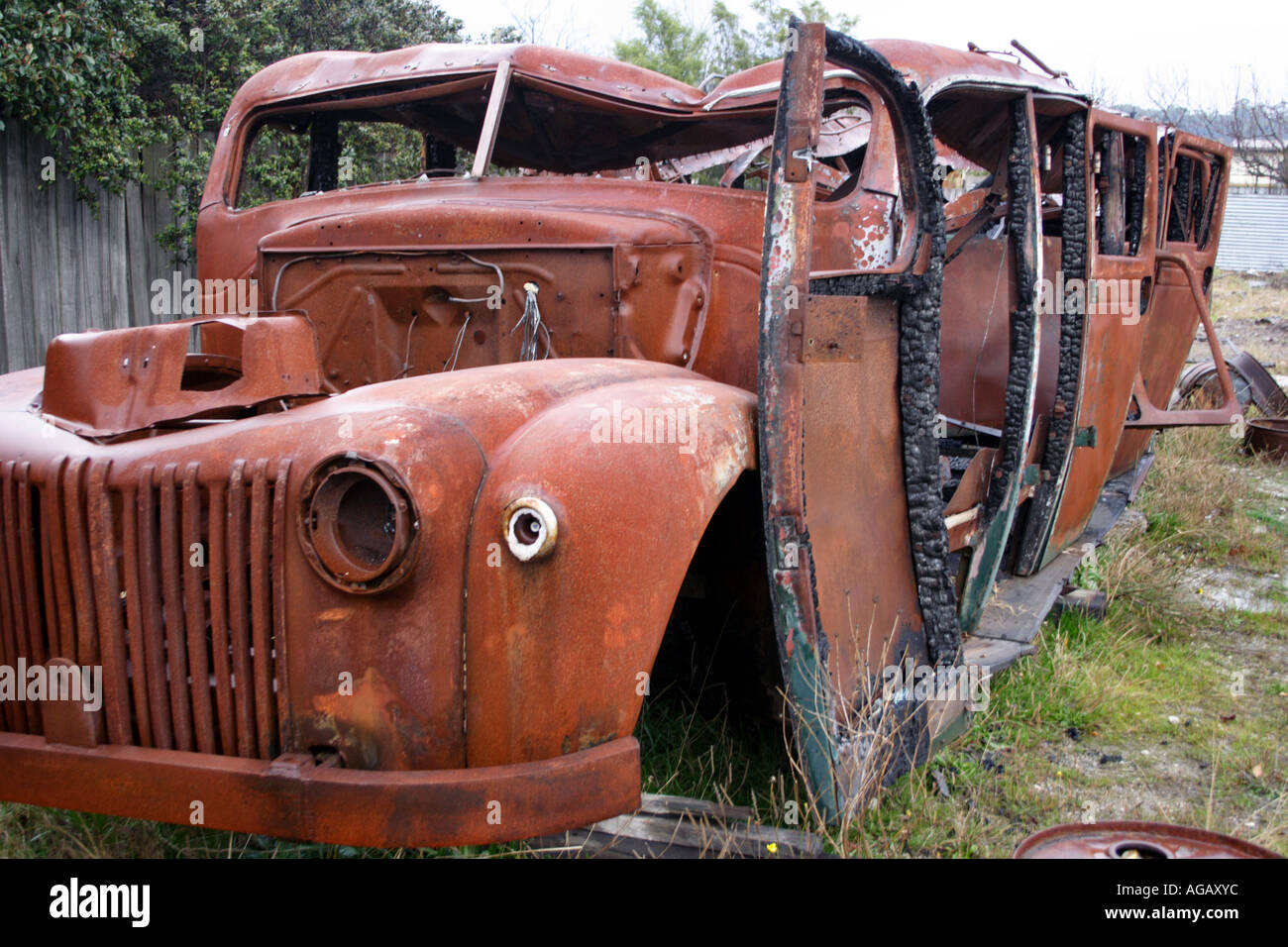 FRONT SIDE VIEW BURNT OUT RUSTY OLD BUS HORIZONTAL BAPDA8860 Stock ...