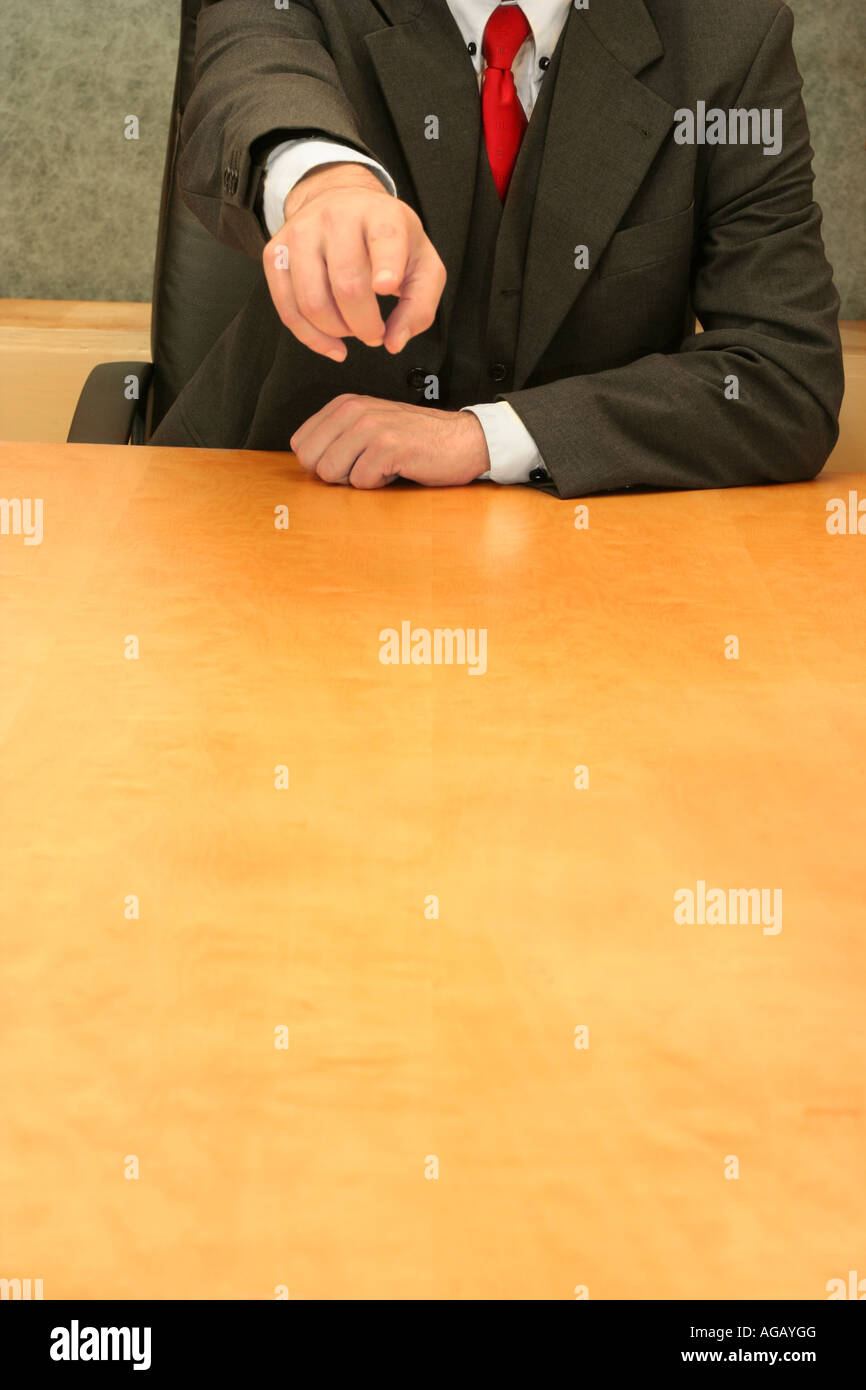 Business man waiting sitting at the desk pointing on you Stock Photo ...
