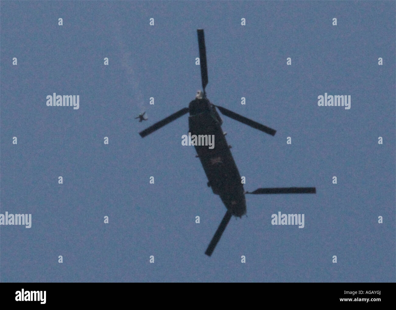 A Free Fall Parachutist Leaping from a Helicopter into a blue sky Stock ...