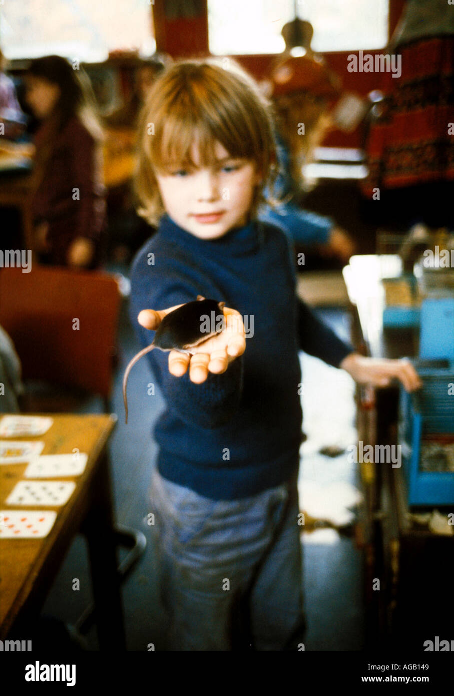 Small boy showing his pet mouse Stock Photo - Alamy