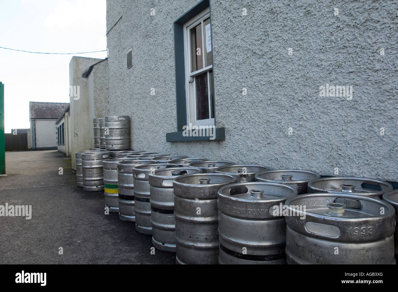 Beer kegs filled with Guinness and other beers line the outside of a ...