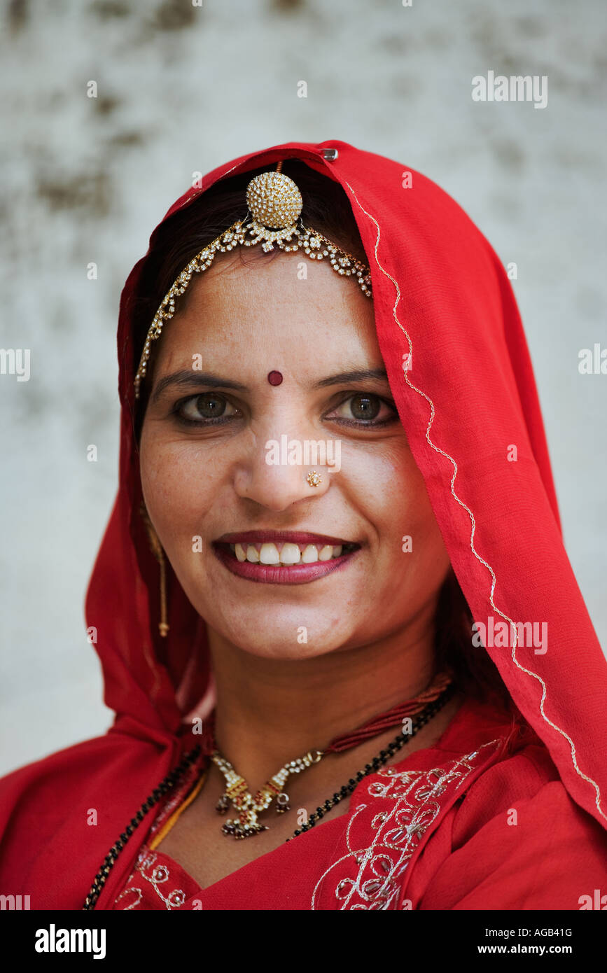 Portrait of a Rajasthani woman dressed in a beautifully decorated sari ...