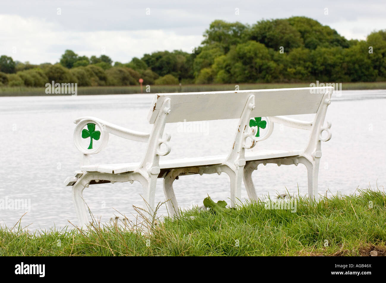White bench overlooking river with shamrock detail in Ireland Stock ...