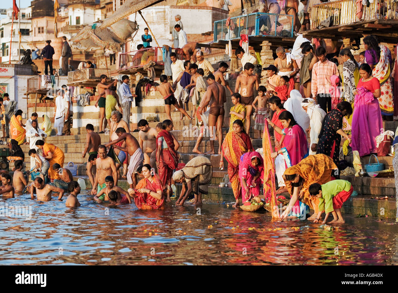 Pilgrims in colourful attire at the ghats in Varanasi India Stock Photo ...