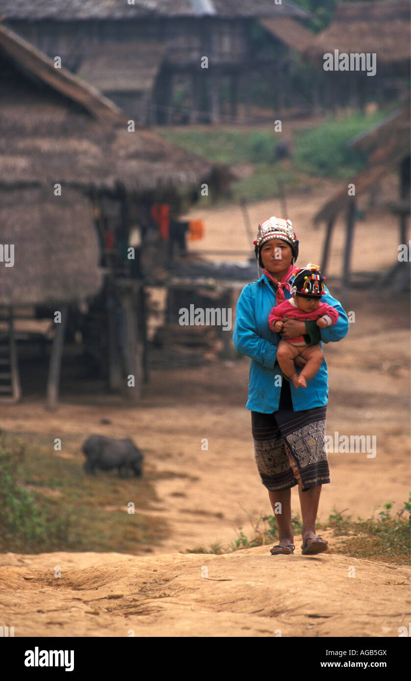 Laos, Luang Namtha, Woman of Hakha or Akha Hill Tribe with baby girl ...