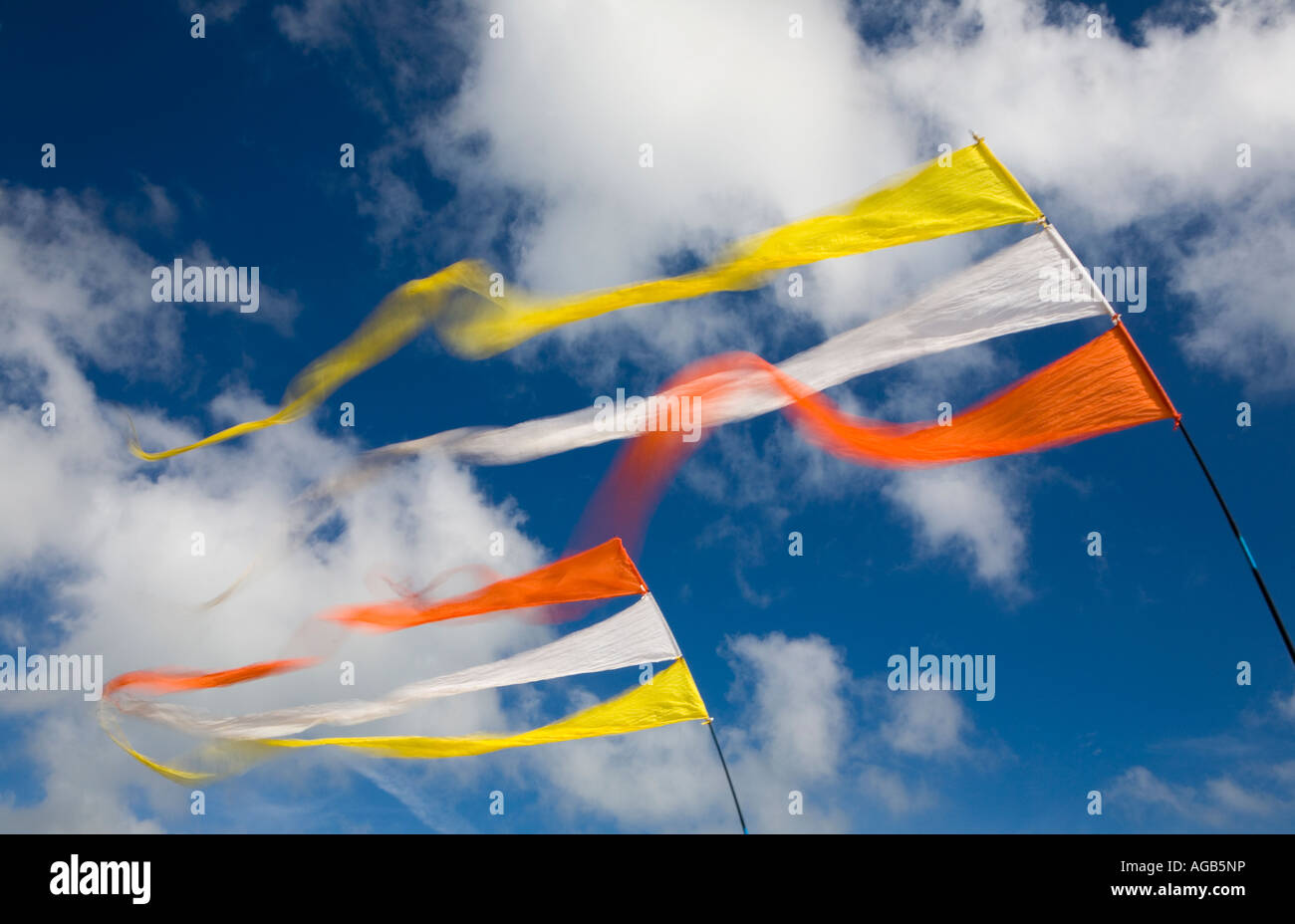 A Pair of Flags blowing in the wind Stock Photo - Alamy