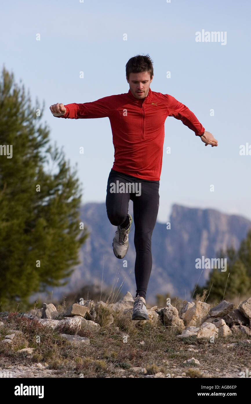 Male runner leaping Stock Photo - Alamy