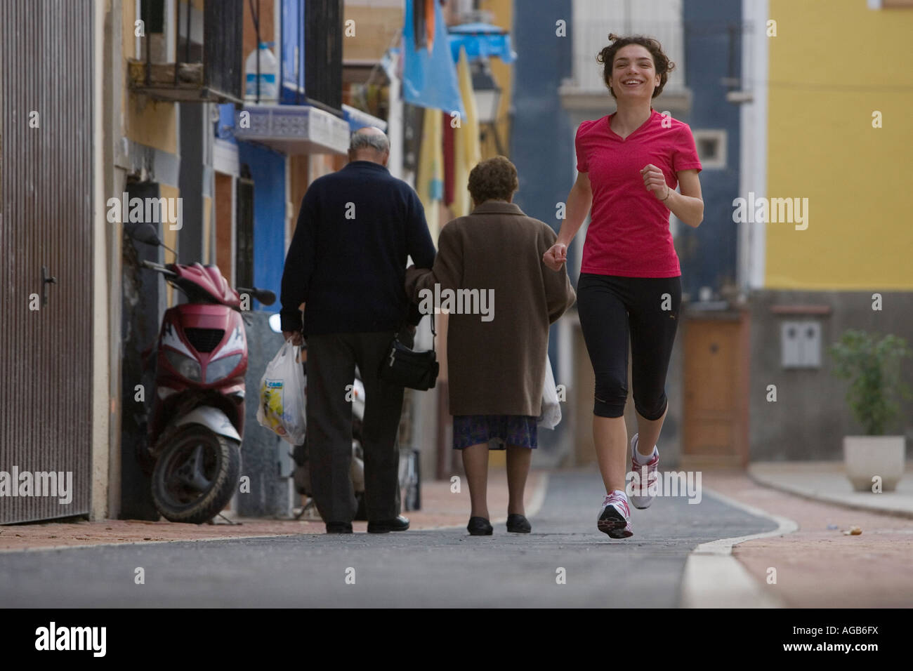 Female running in town Stock Photo - Alamy