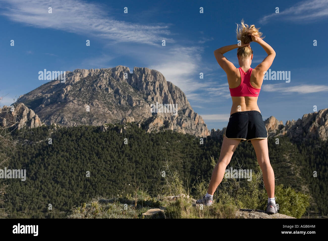 Female runner tying hair Stock Photo - Alamy