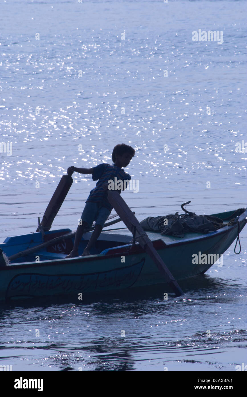 Boy rowing boat hi-res stock photography and images - Alamy