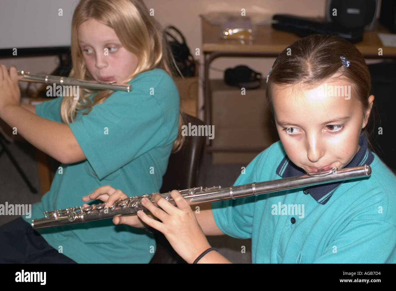2 young girls playing the flute at school Stock Photo - Alamy