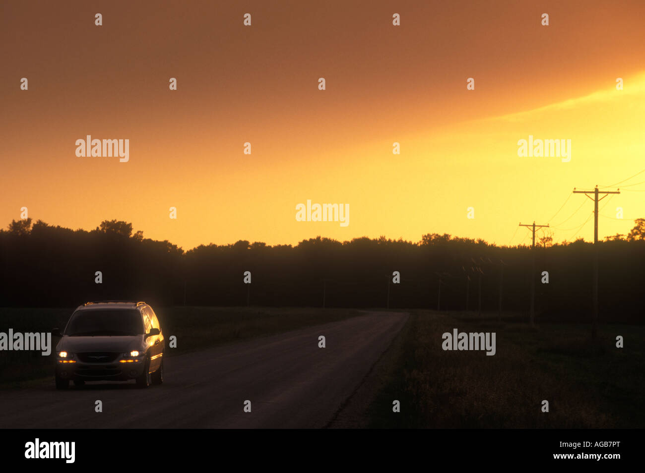 Minivan driving down dirt road in Wisconsin USA Stock Photo - Alamy