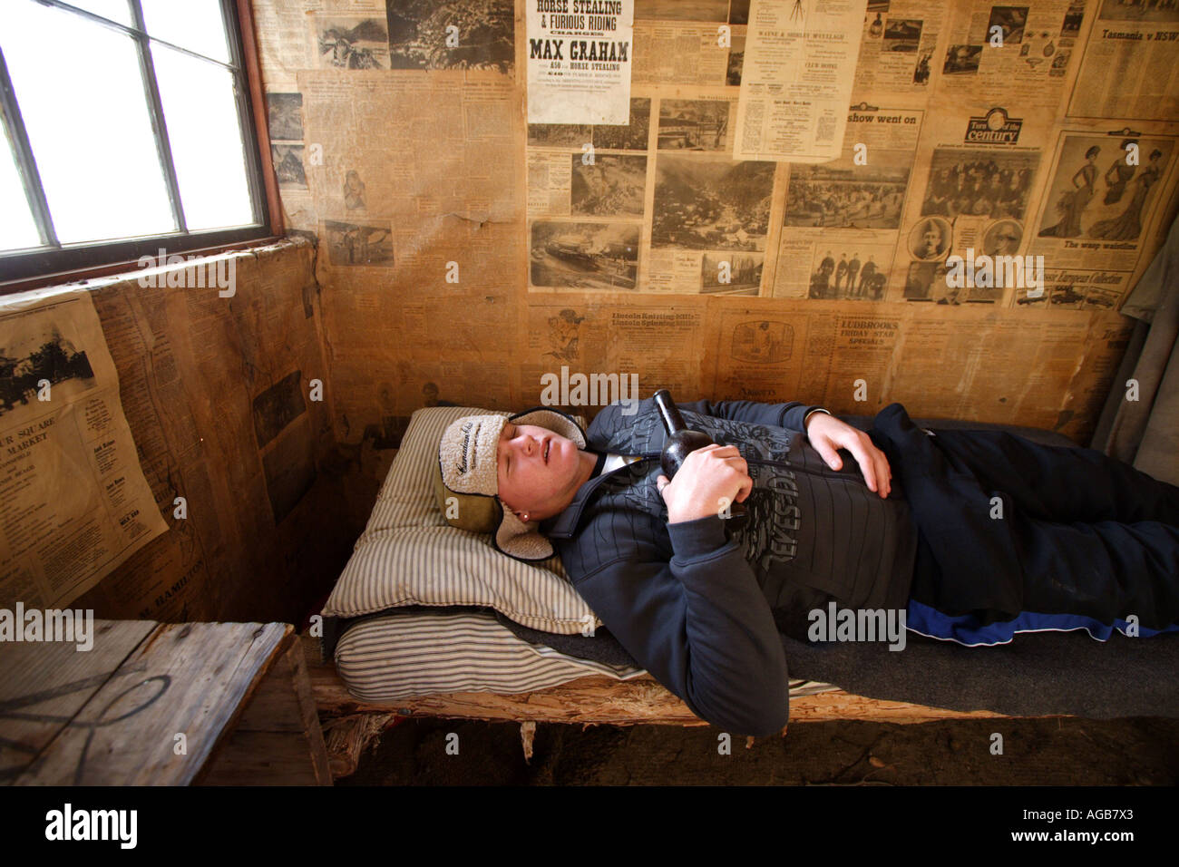 YOUNG MAN PRETENDING TO SLEEP IN MINERS QUARTERS HORIZONTAL BAPDB8505 ...