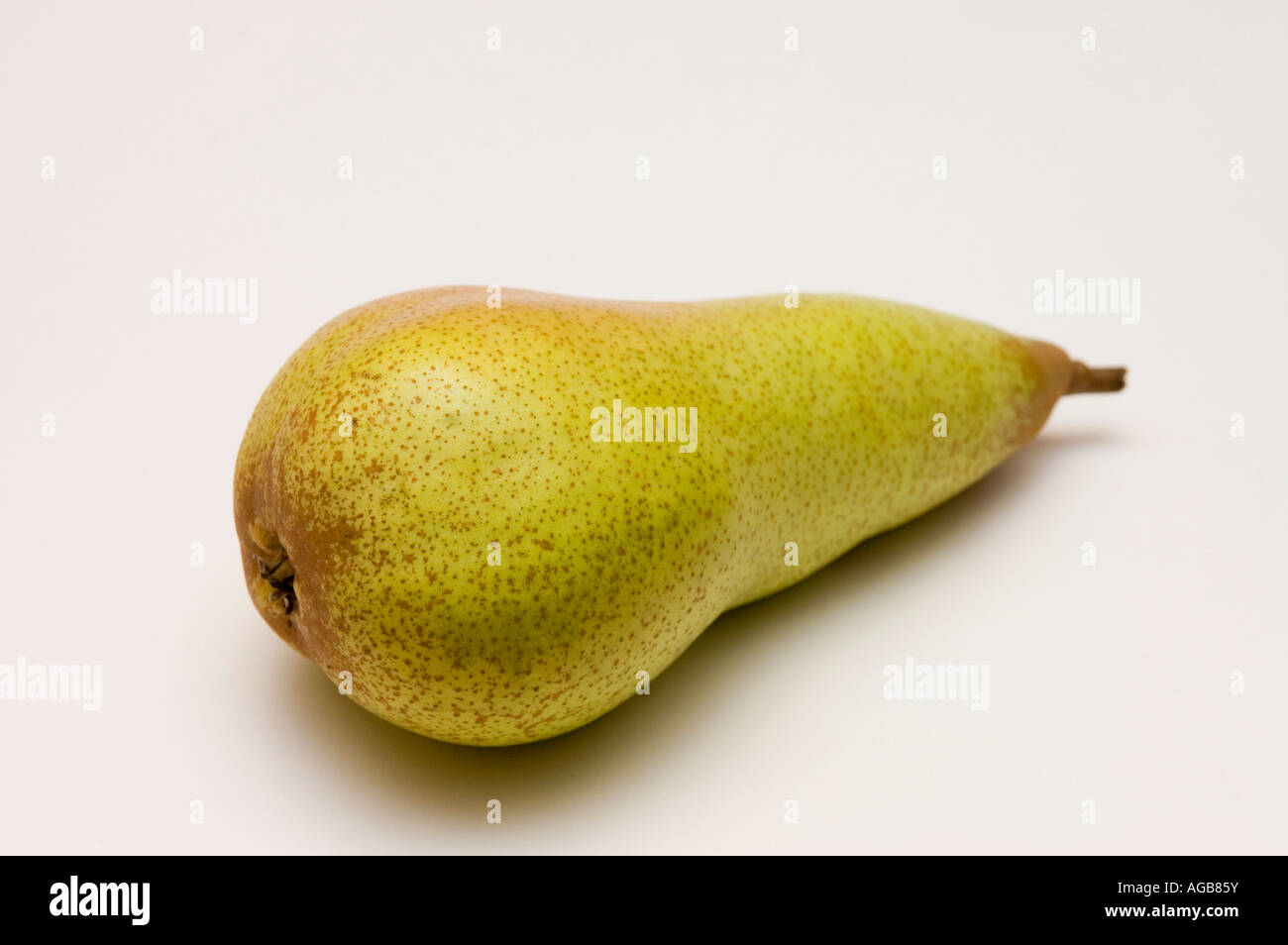 fruit single yellow green pear on white background Stock Photo - Alamy