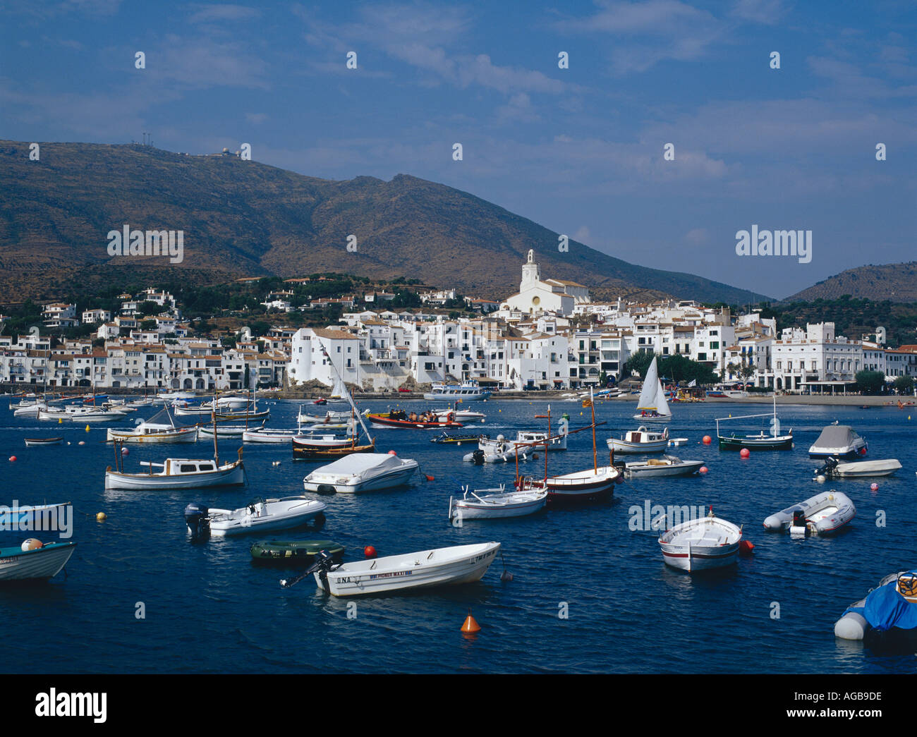The harbour with whitewashed houses on the waterfront in Cadaques Stock ...