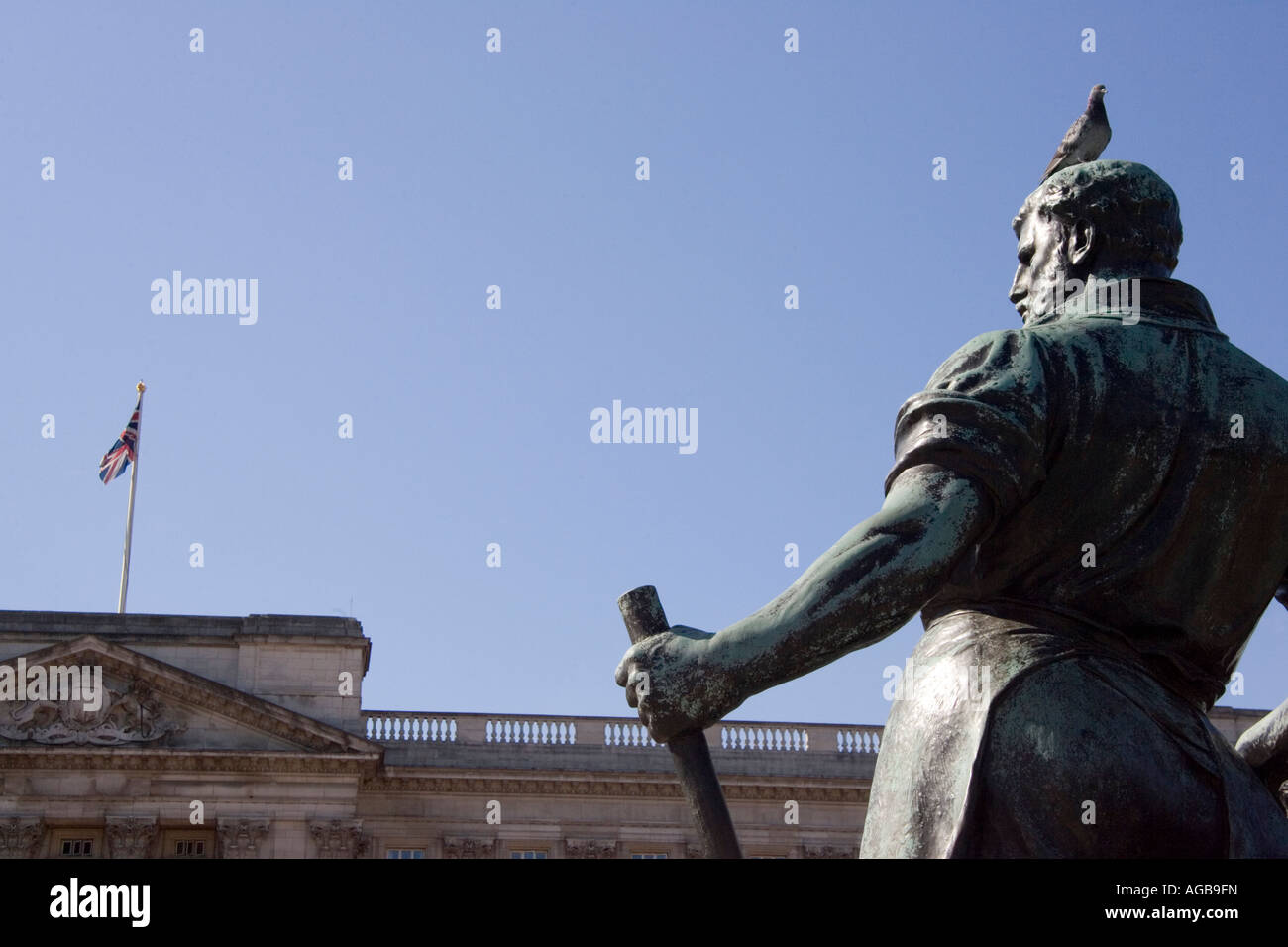 A pigeon sitting on the head of one of the figures on the Victoria ...