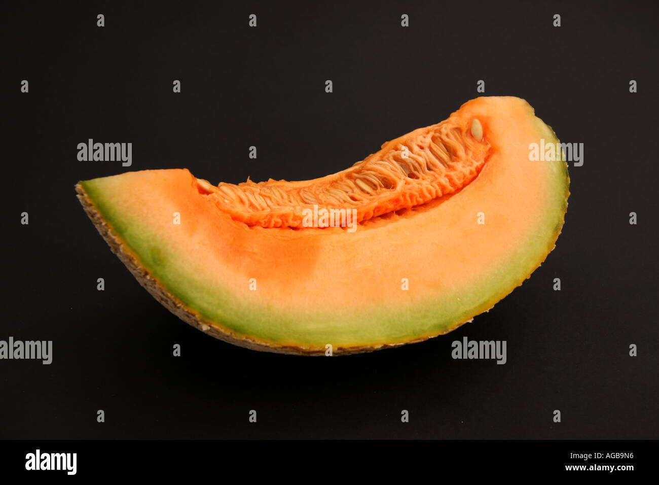 THIN SLICE OF ROCKMELON BLACK BACKGROUND HORIZONTAL BAPDB8292 Stock ...