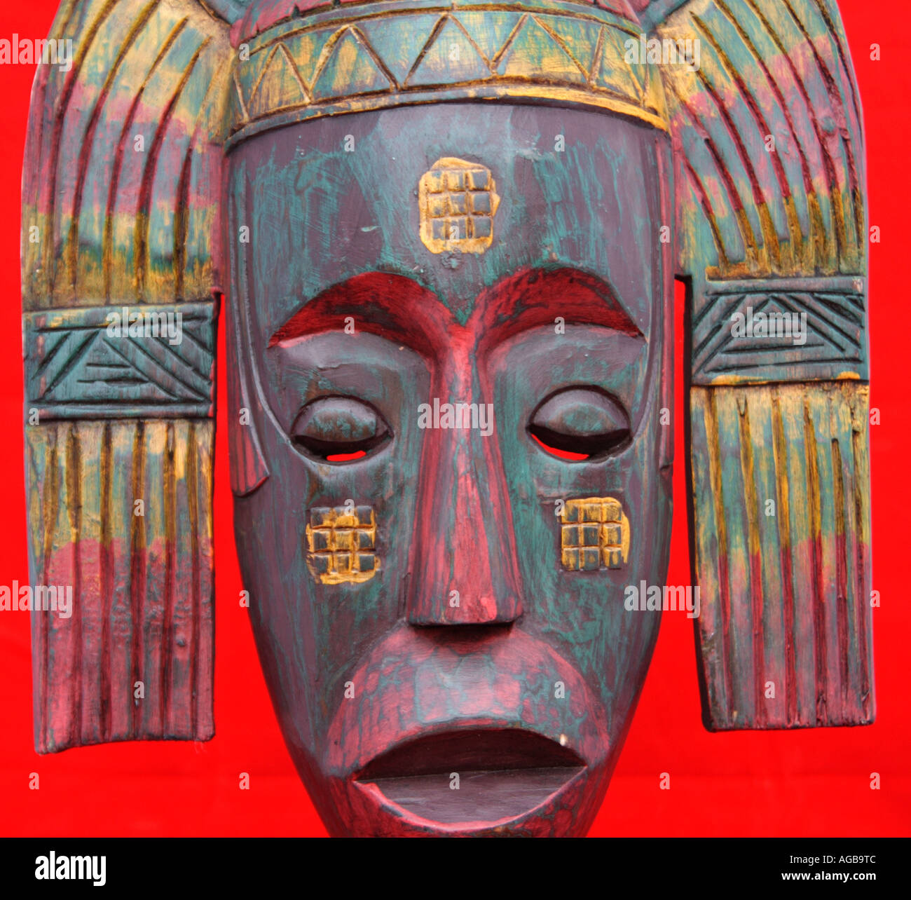 CARVED WOODEN TRIBAL MASK RED BACKGROUND SQUARE FORMAT BAPDB8155 Stock ...