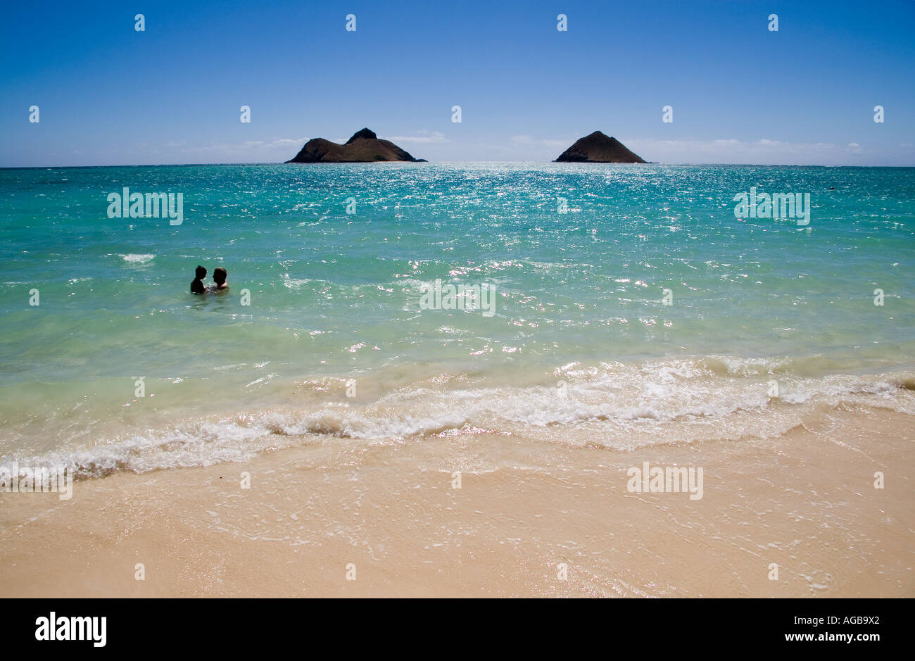 Father and son in the ocean at Lanikai Beach, Hawaii Stock Photo - Alamy