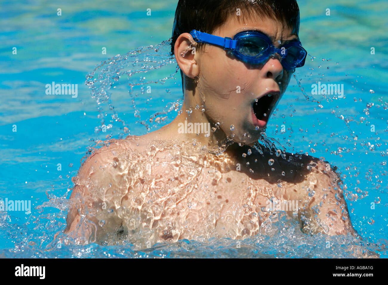 Boy swim swiming pool water play Stock Photo - Alamy