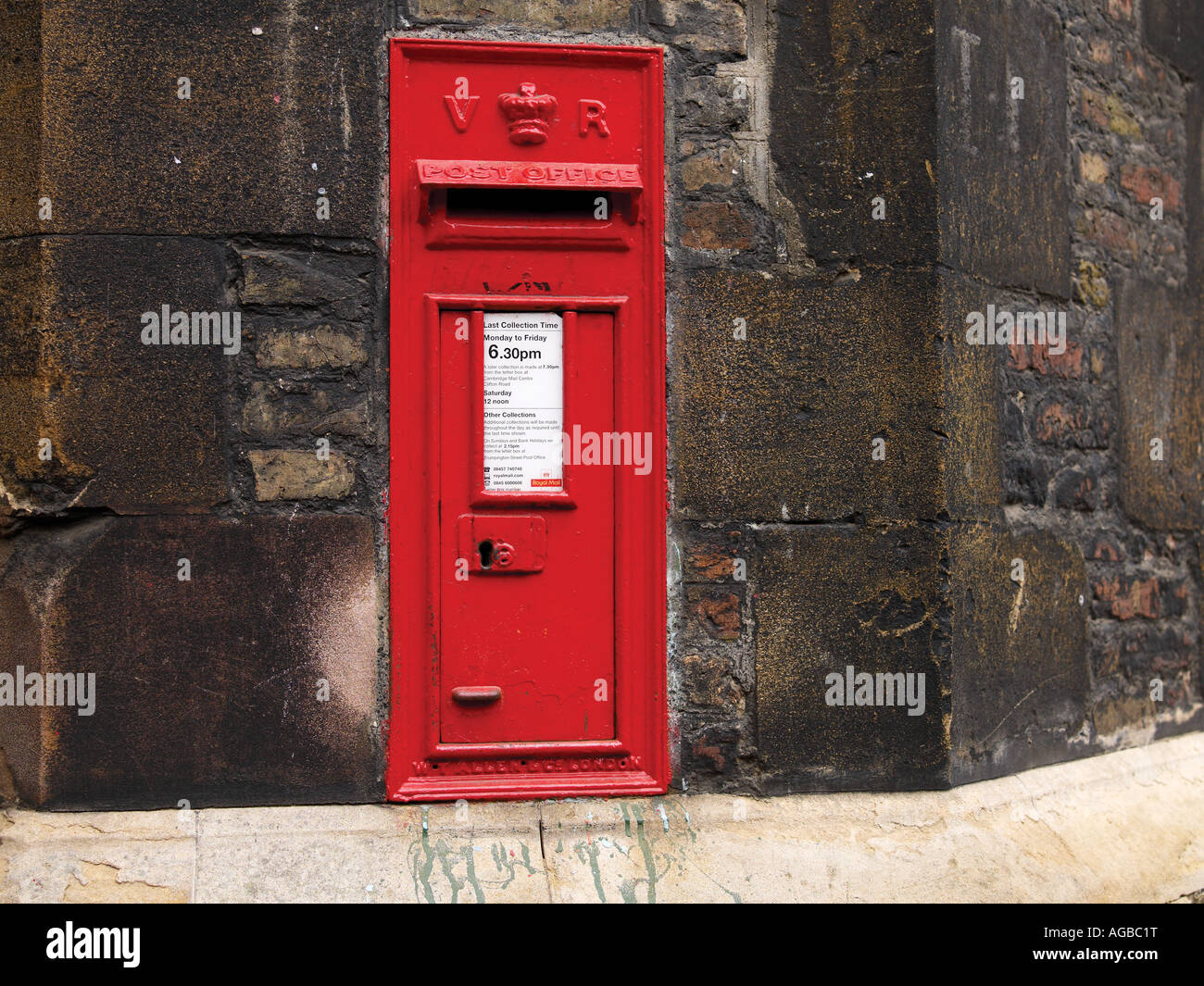 A red post box stands in a stone wall Stock Photo - Alamy