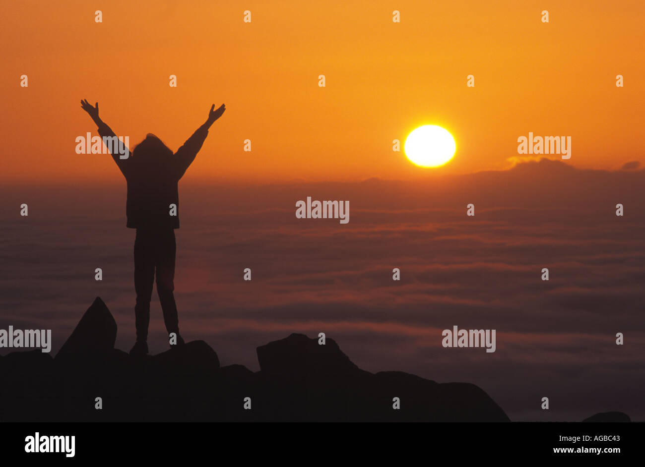 Woman standing above clouds Harlech Gwynedd Wales UK 46926DN Stock ...