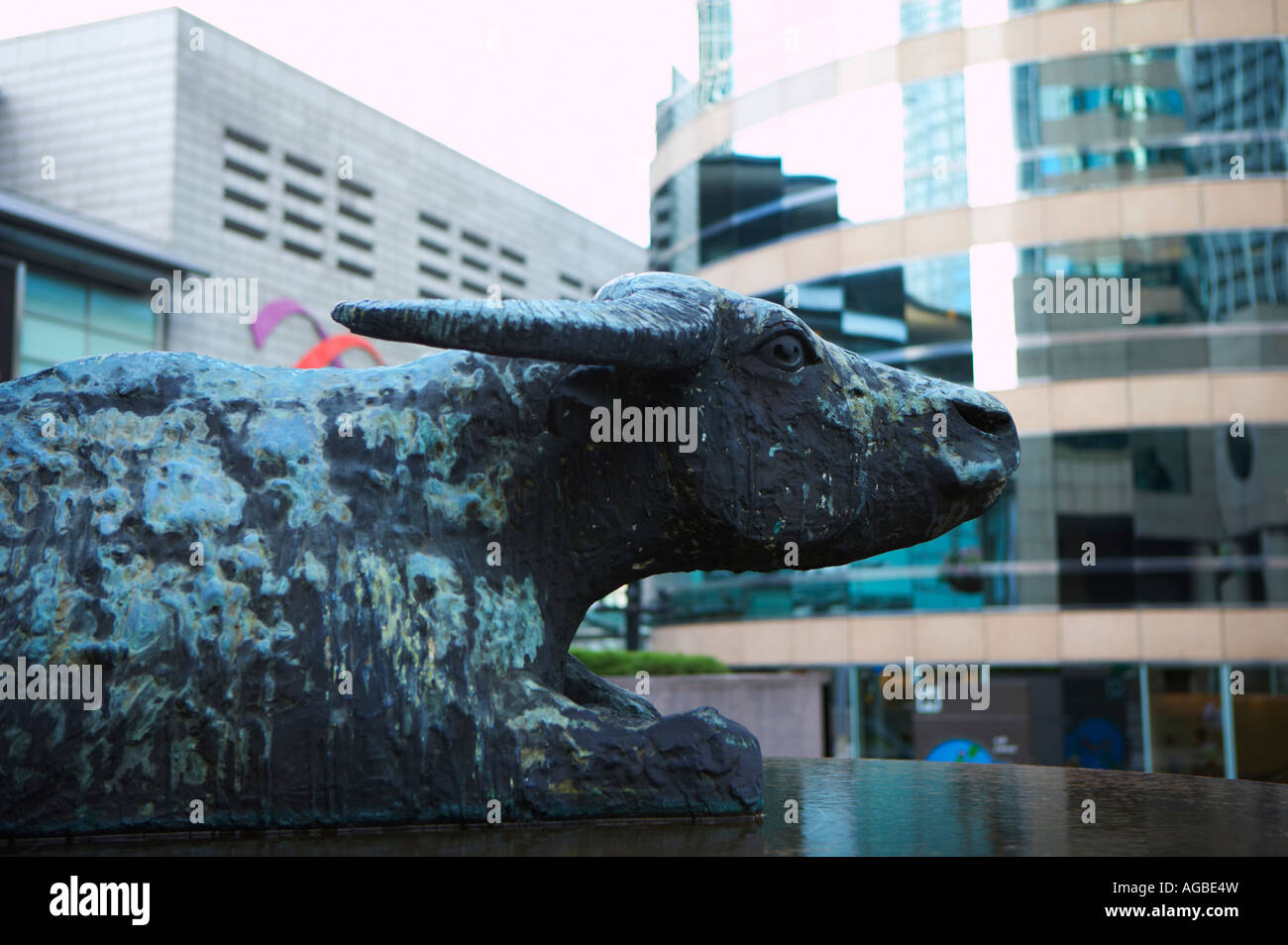 Hong Kong Stock Exchange building and the bull statue at the entrance ...