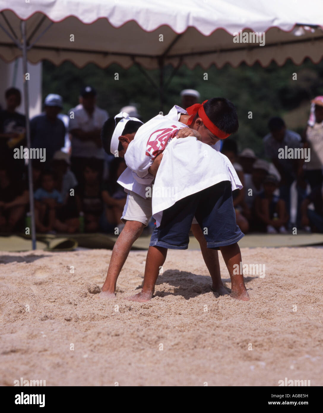 Young Okinawan boys taking part in Okinawan style sumo wrestling Stock ...