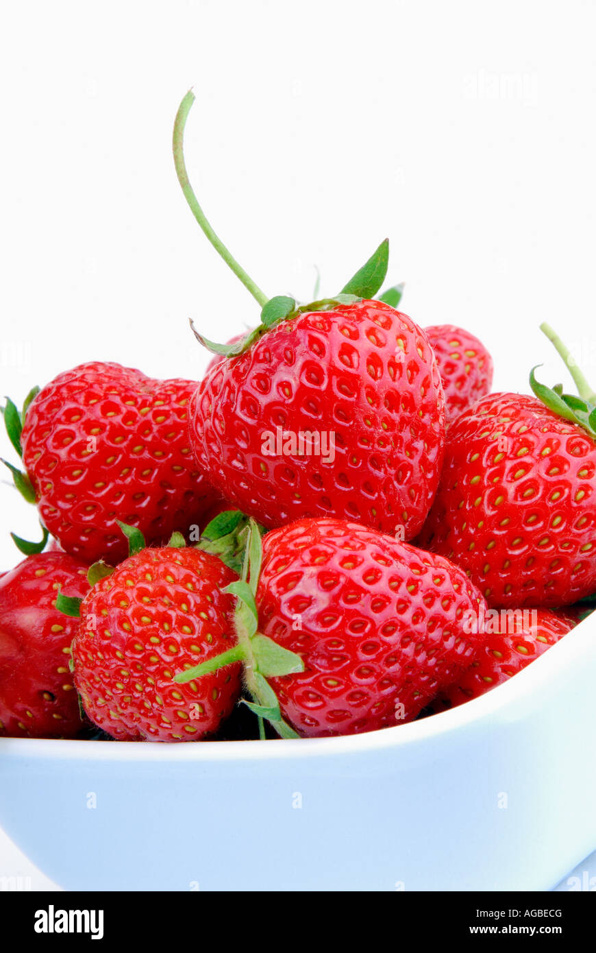 Strawberries In A Small Blue Bowl Stock Photo - Alamy