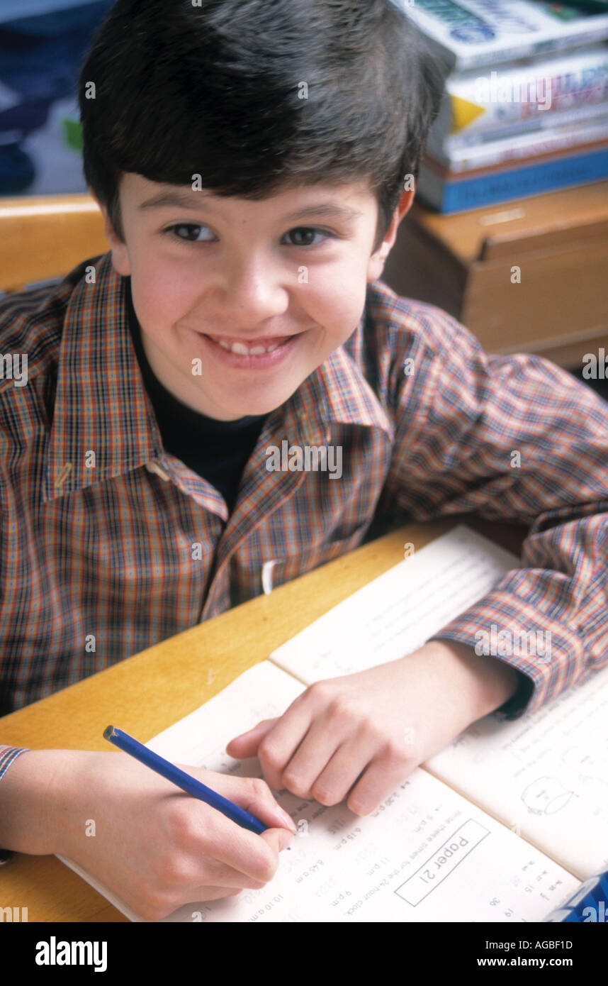 Close up of child doing homework Stock Photo - Alamy